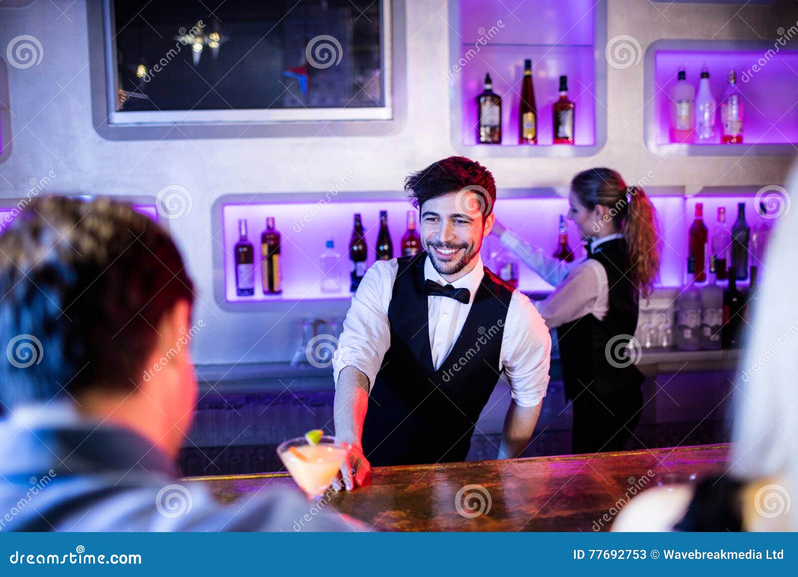Waiter serving cocktail stock image. Image of glass, classy - 77692753