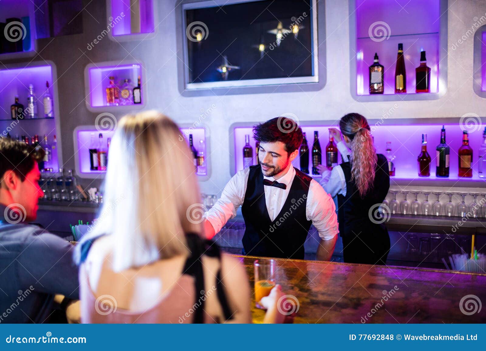 Waiter serving cocktail stock photo. Image of activity - 77692848