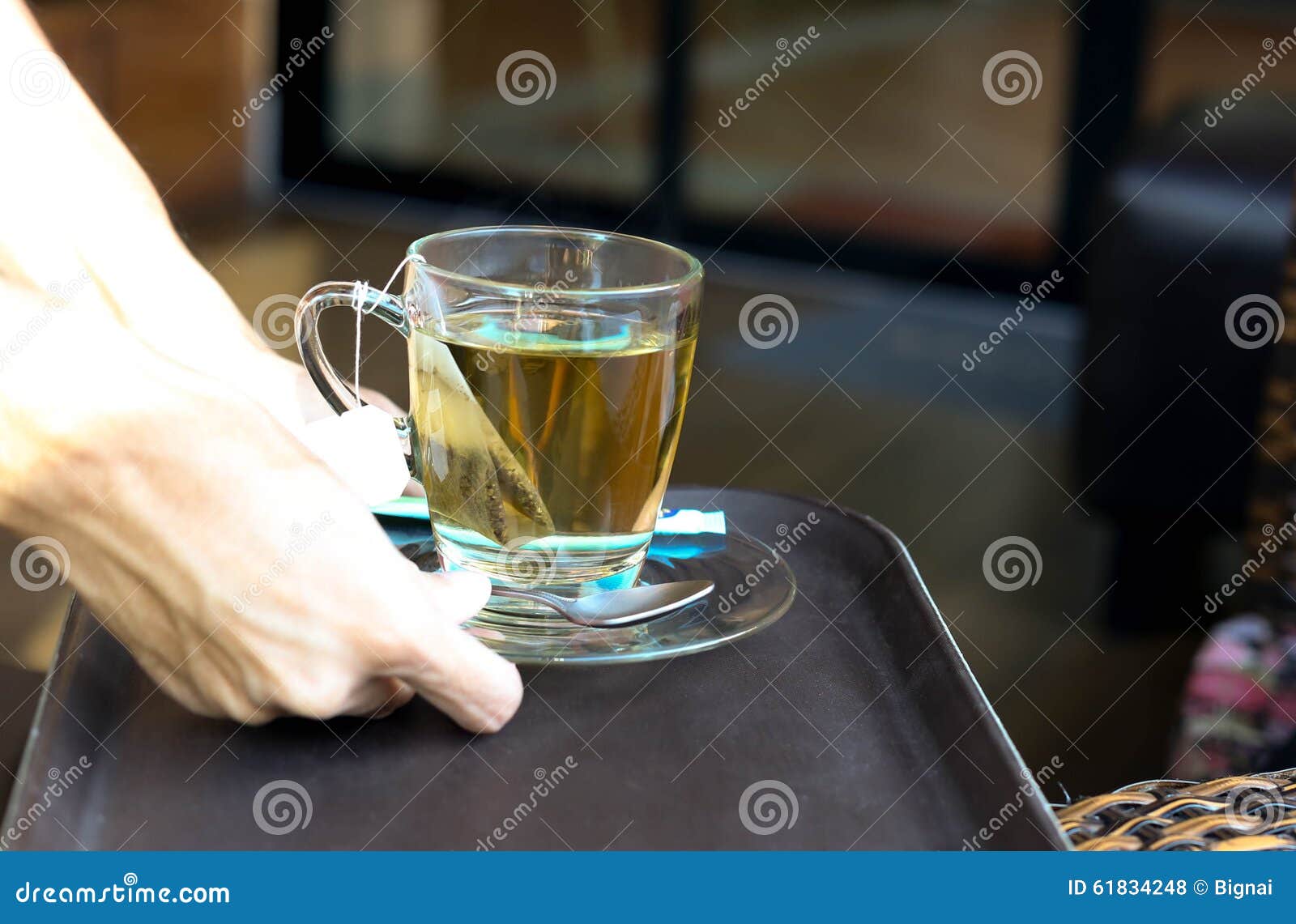 Waiter serving cup of tea stock photo. Image of service - 61834248