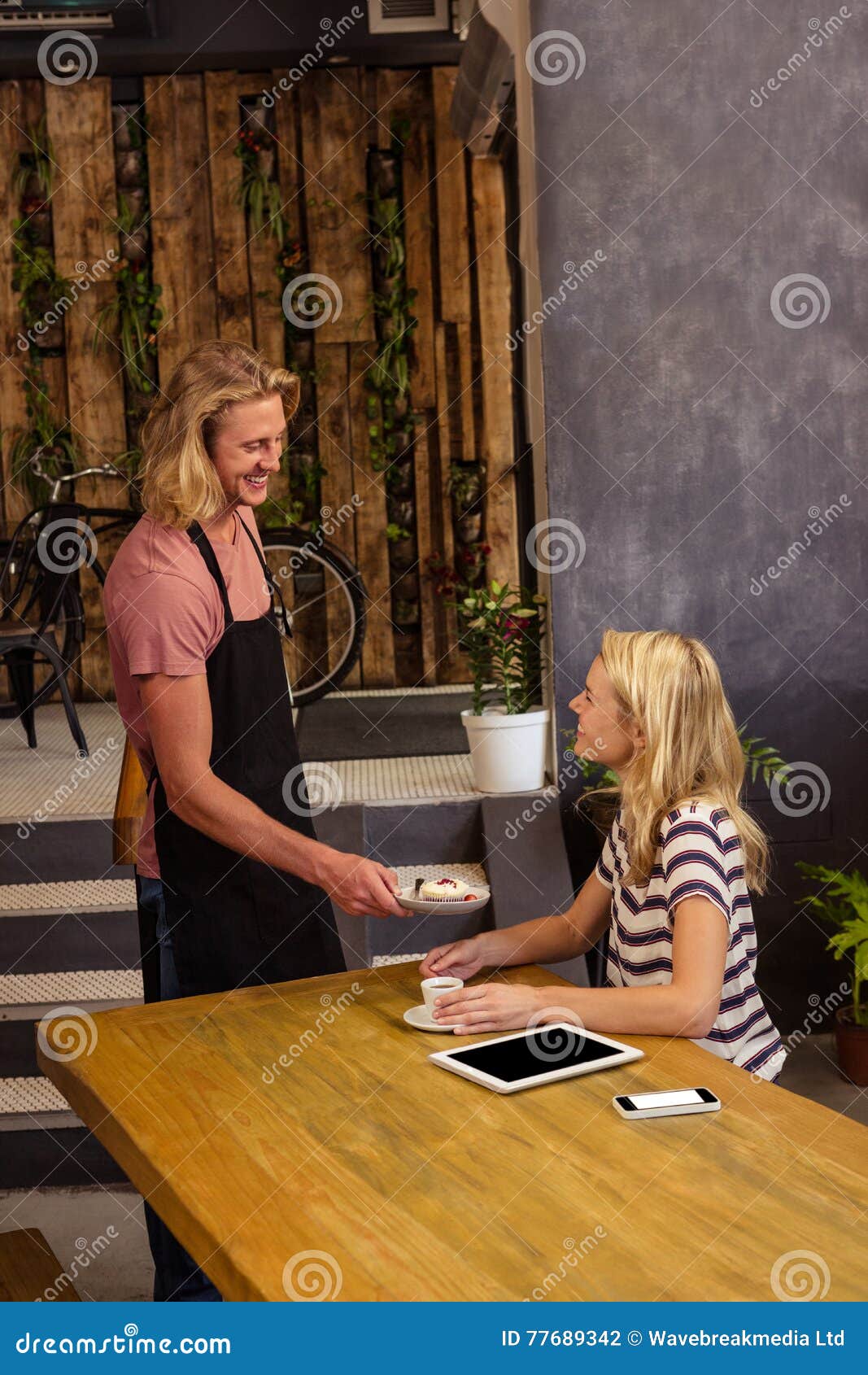 Waiter Serving Food To Client Stock Photo - Image of cafeteria, fashion ...