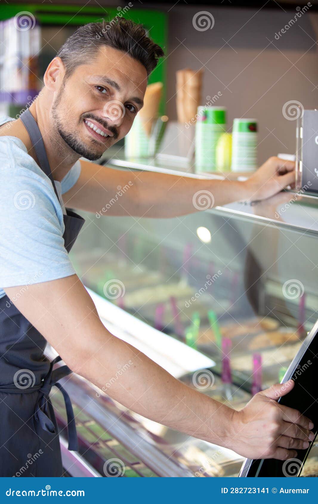 Waiter serving ice cream stock image. Image of person - 282723141