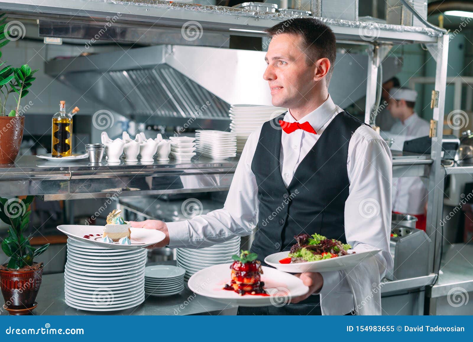 Waiter Serving in Motion on Duty in Restaurant. the Waiter Carries ...