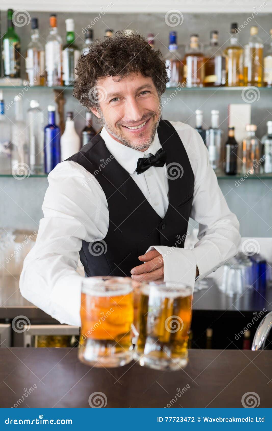 Waiter Serving Mug of Beers Stock Photo - Image of waistcoat ...