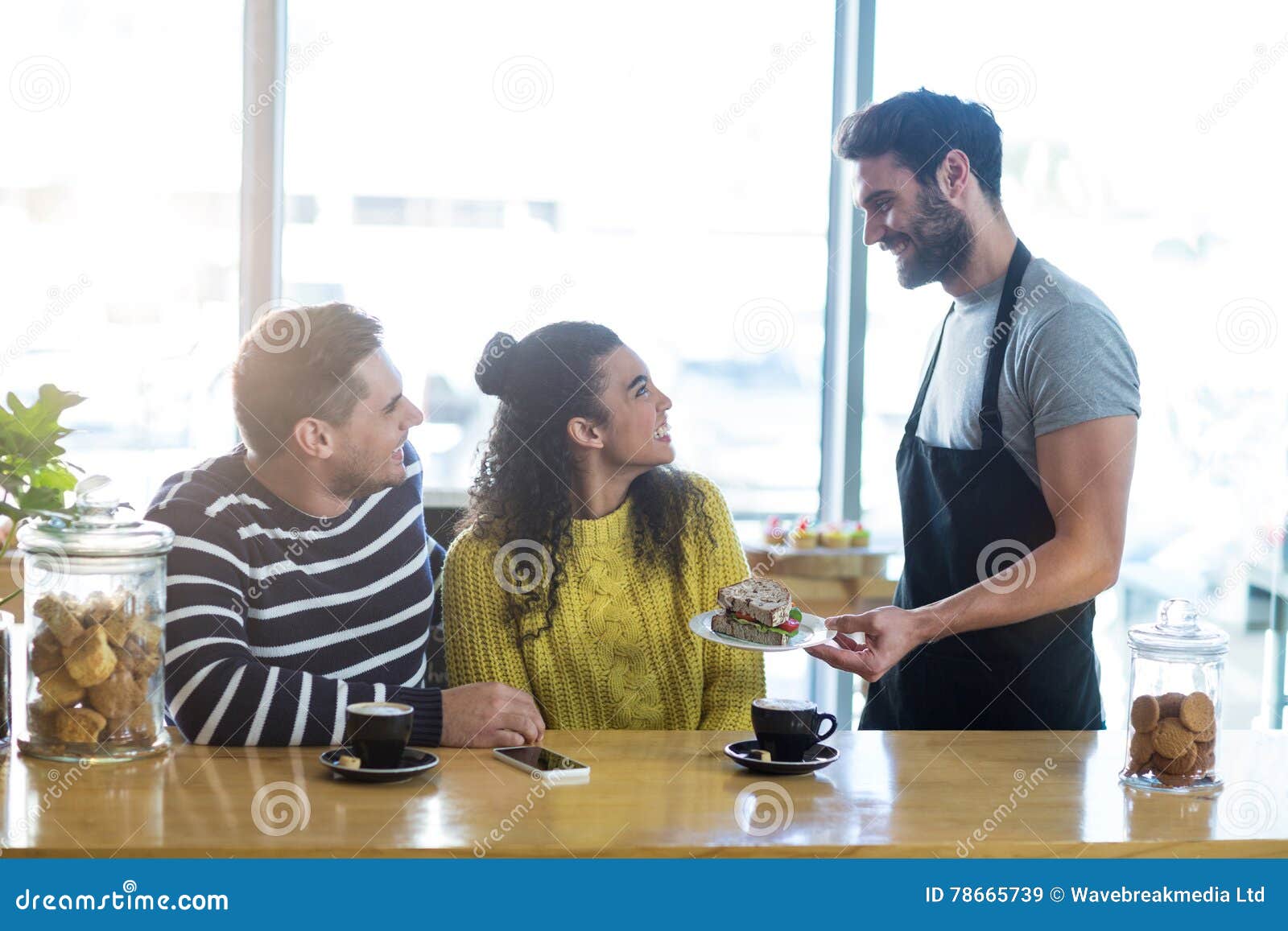 Waiter Serving a Plate of Sandwich To Customer Stock Image - Image of ...