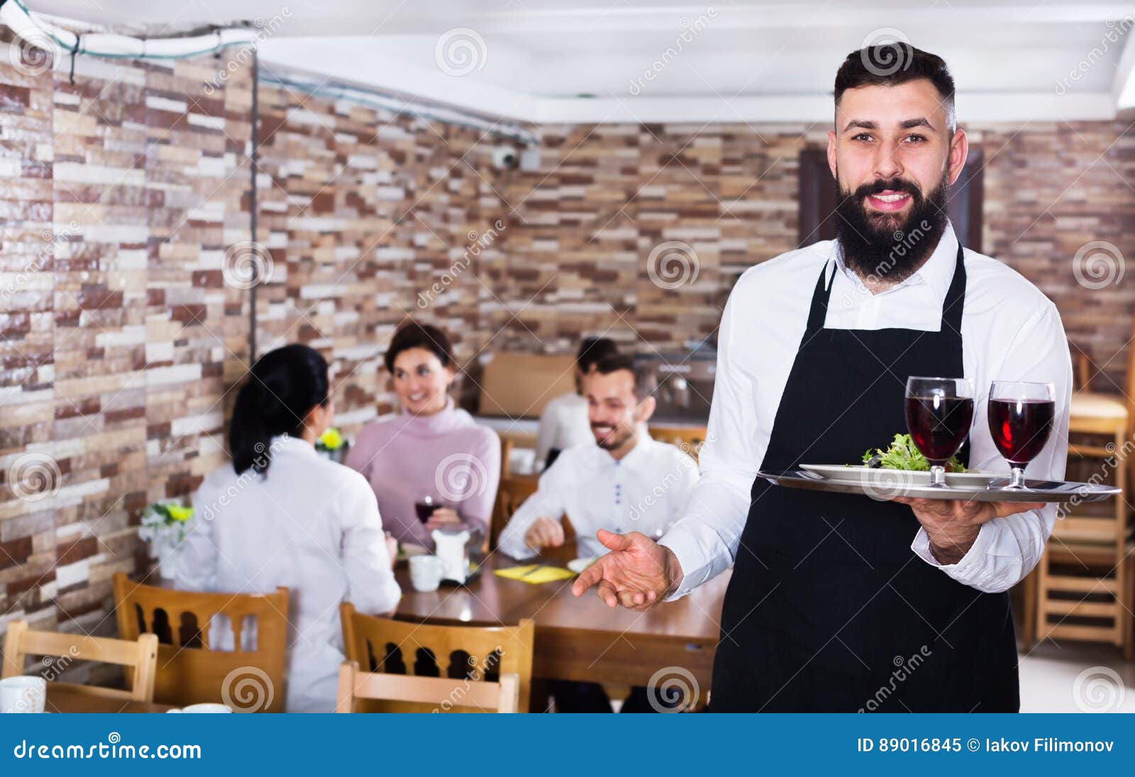 Waiter Serving Restaurant Guests Stock Image - Image of american ...