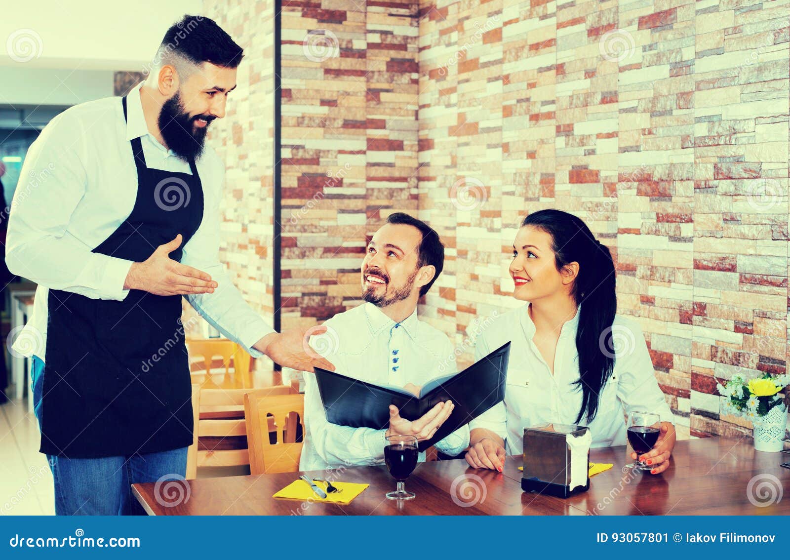 Waiter Serving Rural Restaurant Guests at Table Stock Image - Image of ...