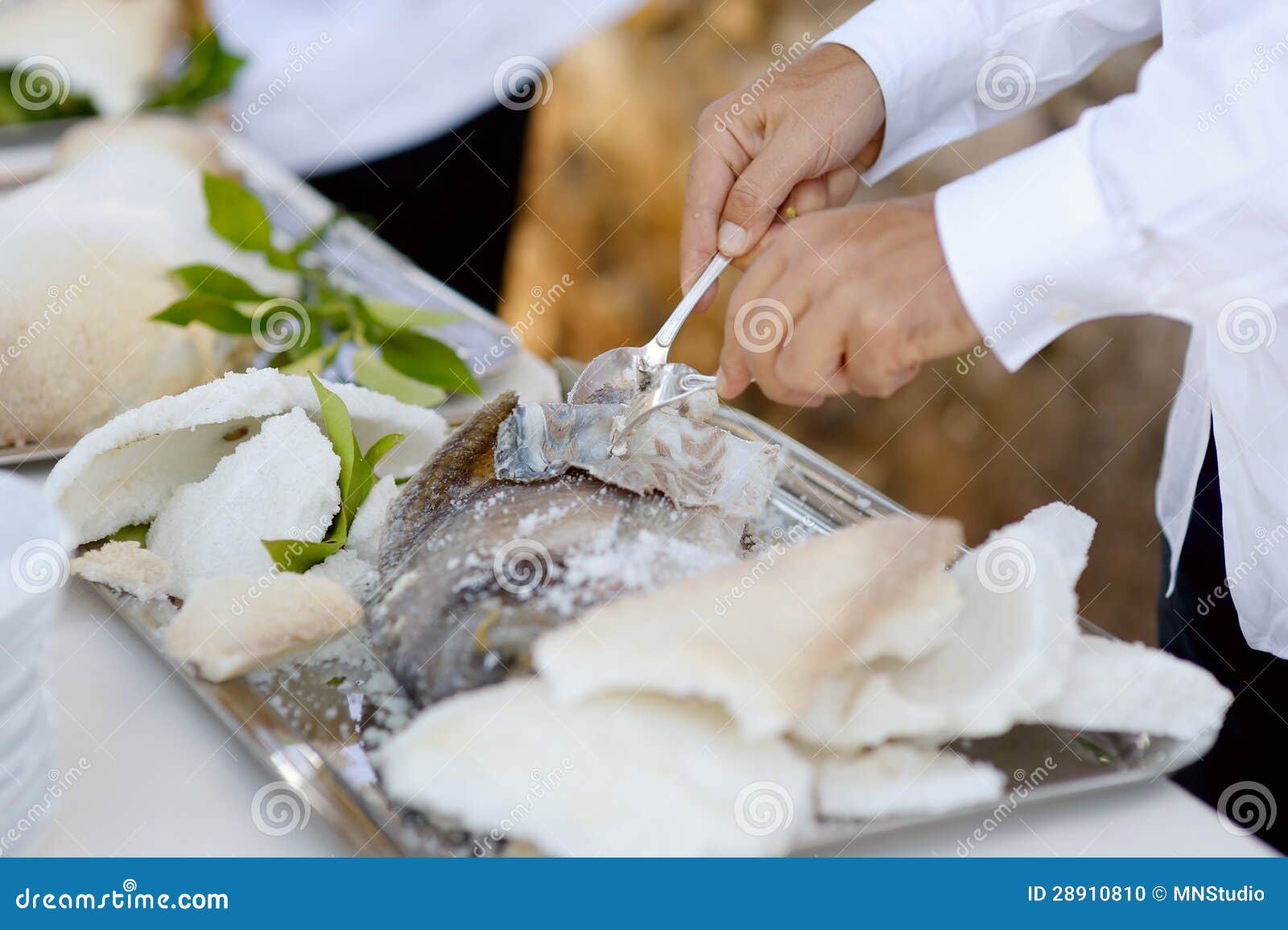 Waiter Serving a Tasty Fish Stock Photo - Image of food, dining: 28910810
