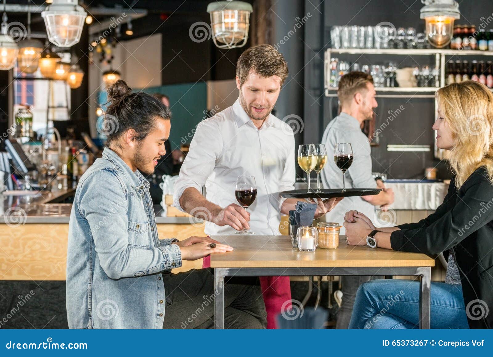 Waiter Serving Wine To Customers in Bar Stock Image - Image of looking ...