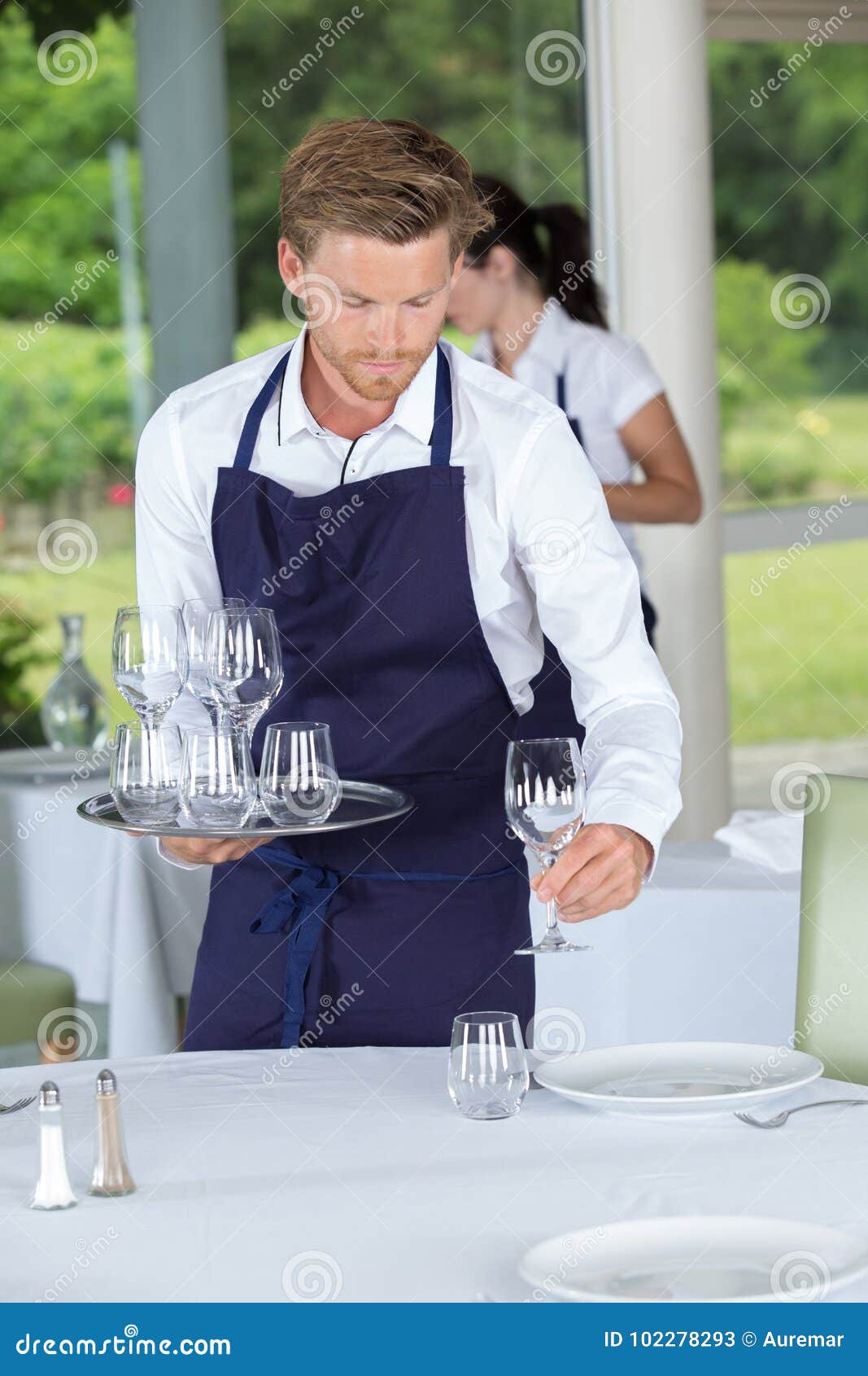 Waiter Setting Table in Bar Stock Image - Image of restaurant, layout ...