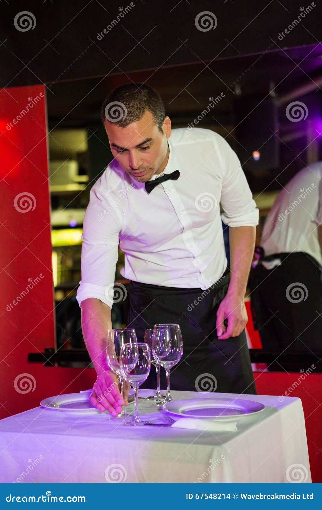 Waiter setting a table stock photo. Image of restaurant - 67548214