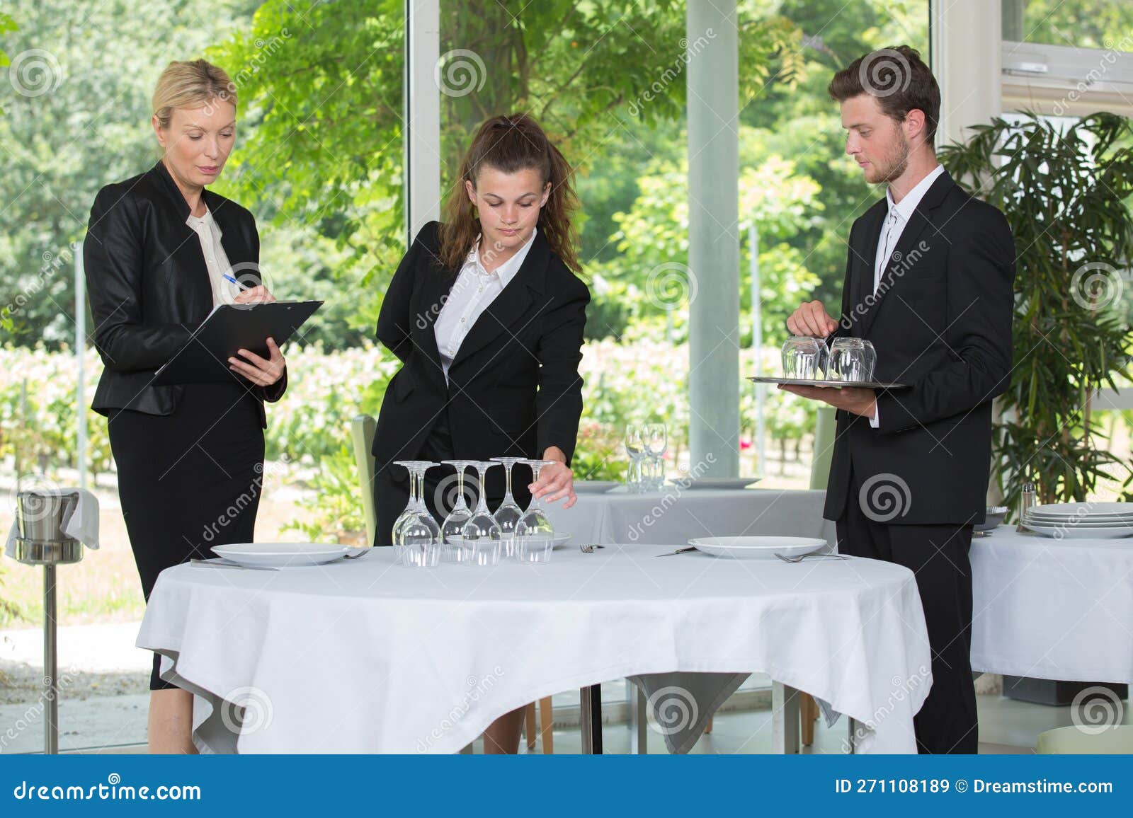 Waiter Setting Table in Bar Stock Image - Image of bowtie, male: 271108189