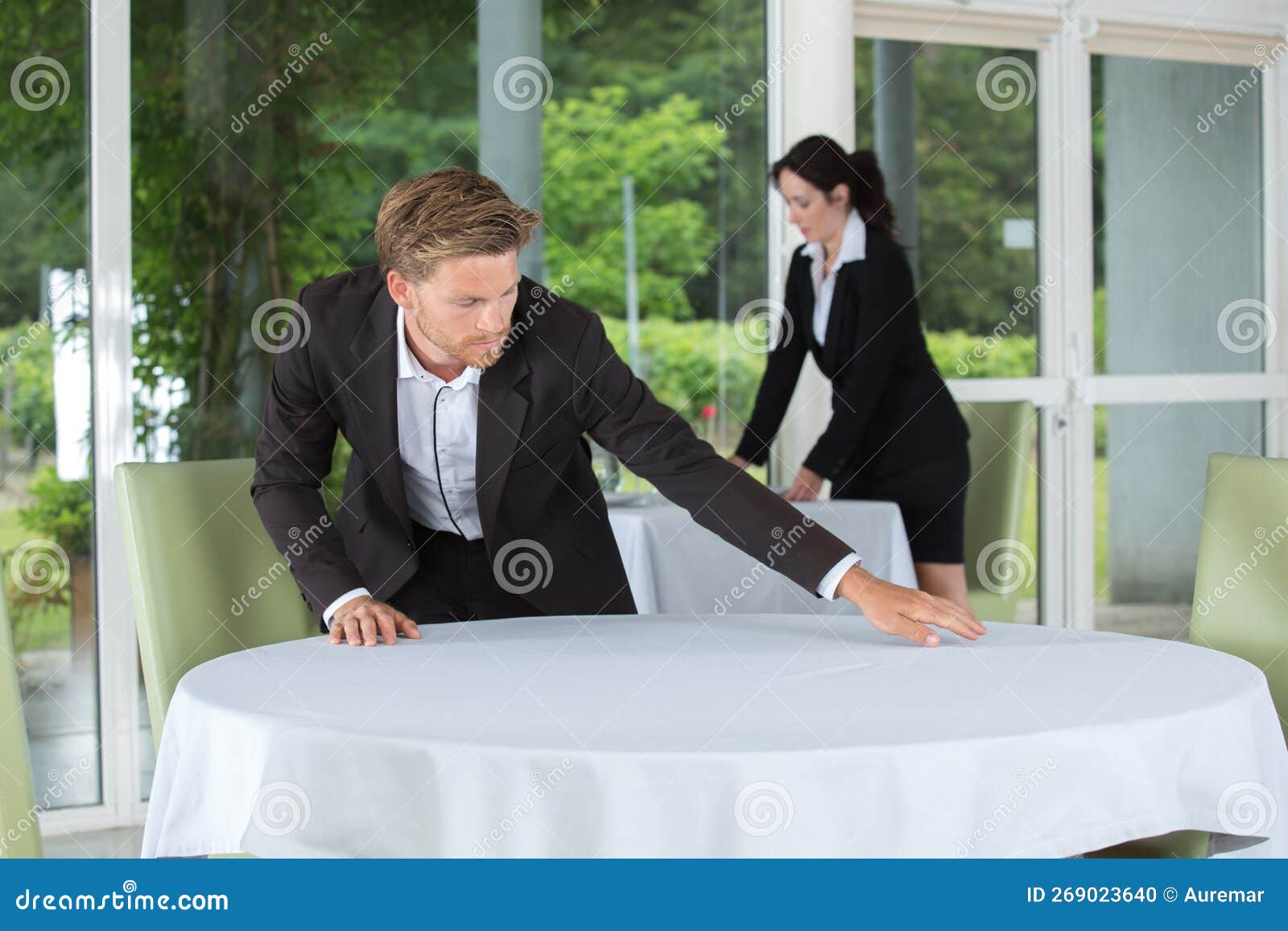 Waiter Setting Table in Restaurant Stock Photo - Image of lunch, woman ...