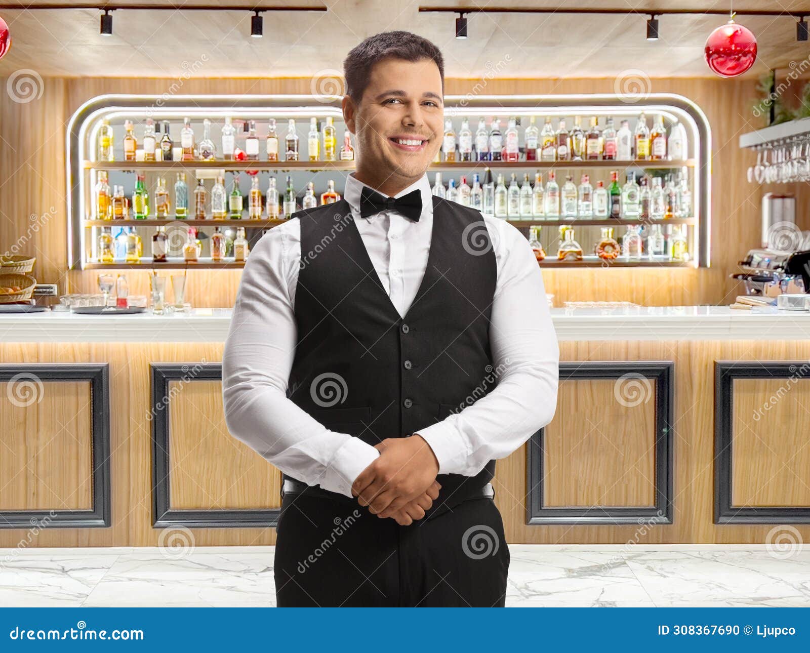 Waiter Smiling and Posing in Front of a Hotel Bar Stock Photo - Image ...