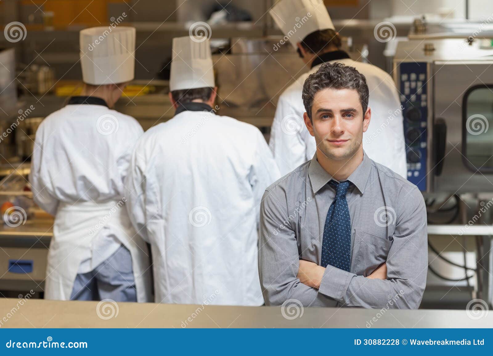 Waiter Standing in the Kitchen Stock Photo - Image of restaurant ...