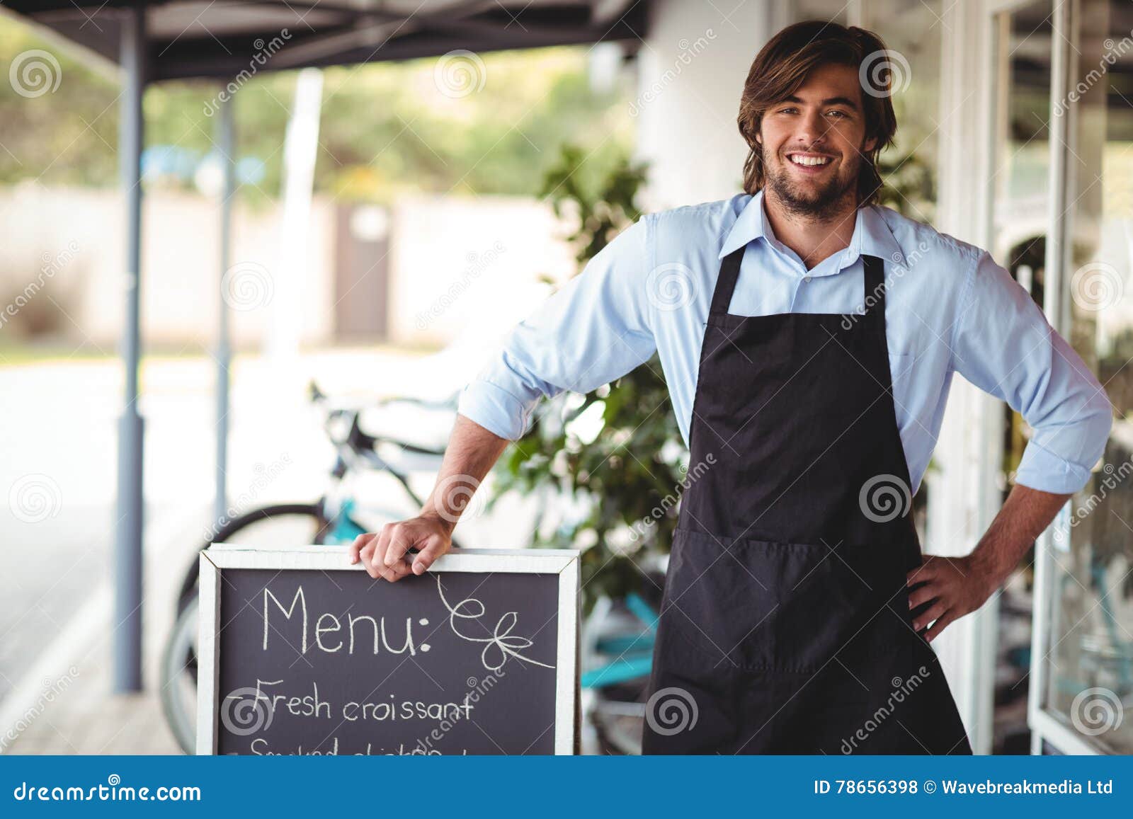 Waiter Standing with Menu Board Outside the Cafe Stock Photo - Image of ...
