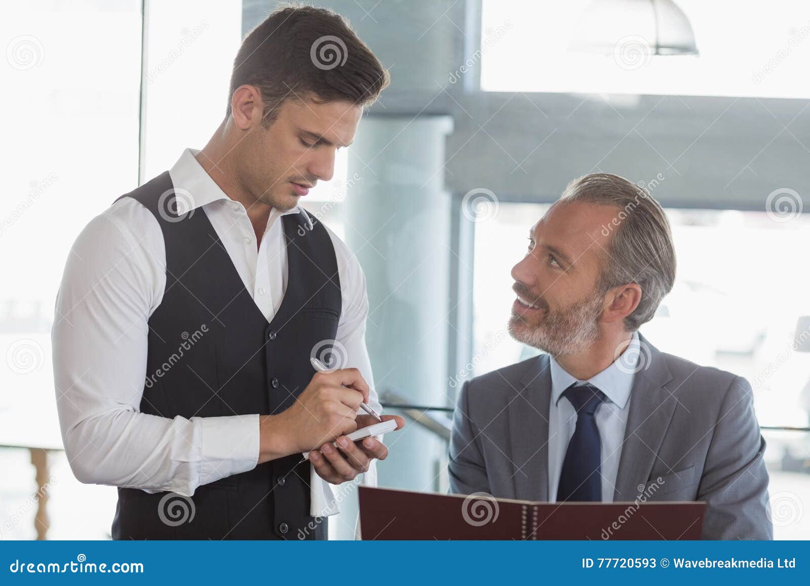 Waiter Taking the Order from a Businessman Stock Image - Image of ...