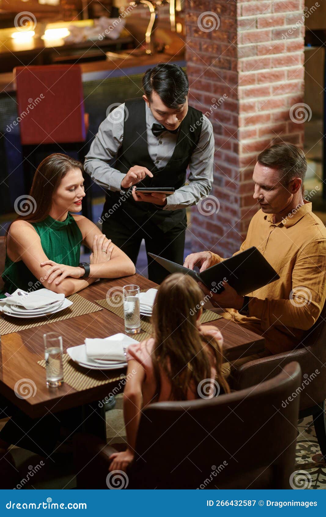 Waiter Taking Order stock image. Image of restaurant - 266432587