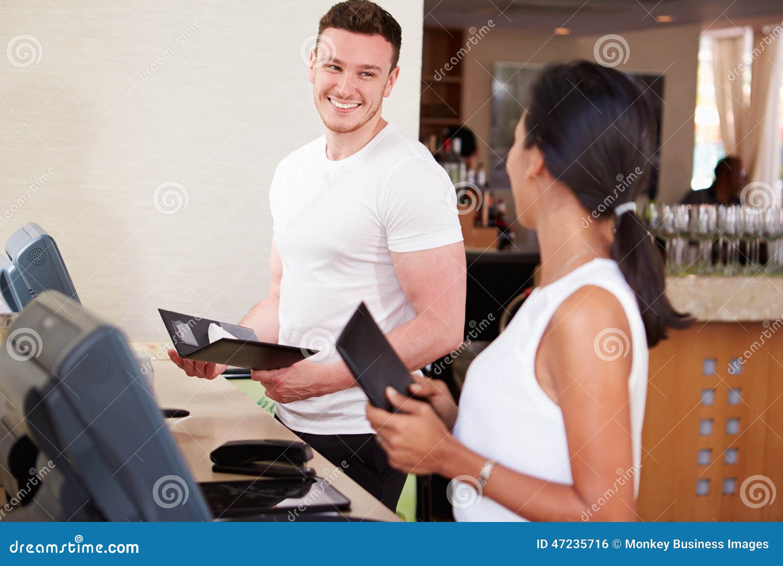 Waiter and Waitress in Hotel Restaurant Preparing Bill Stock Photo ...
