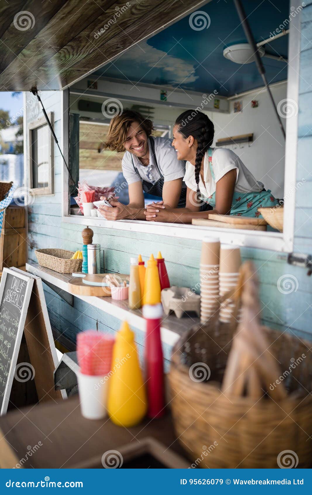 Waiter and Waitress Interacting with Each Other at Counter Stock Image ...