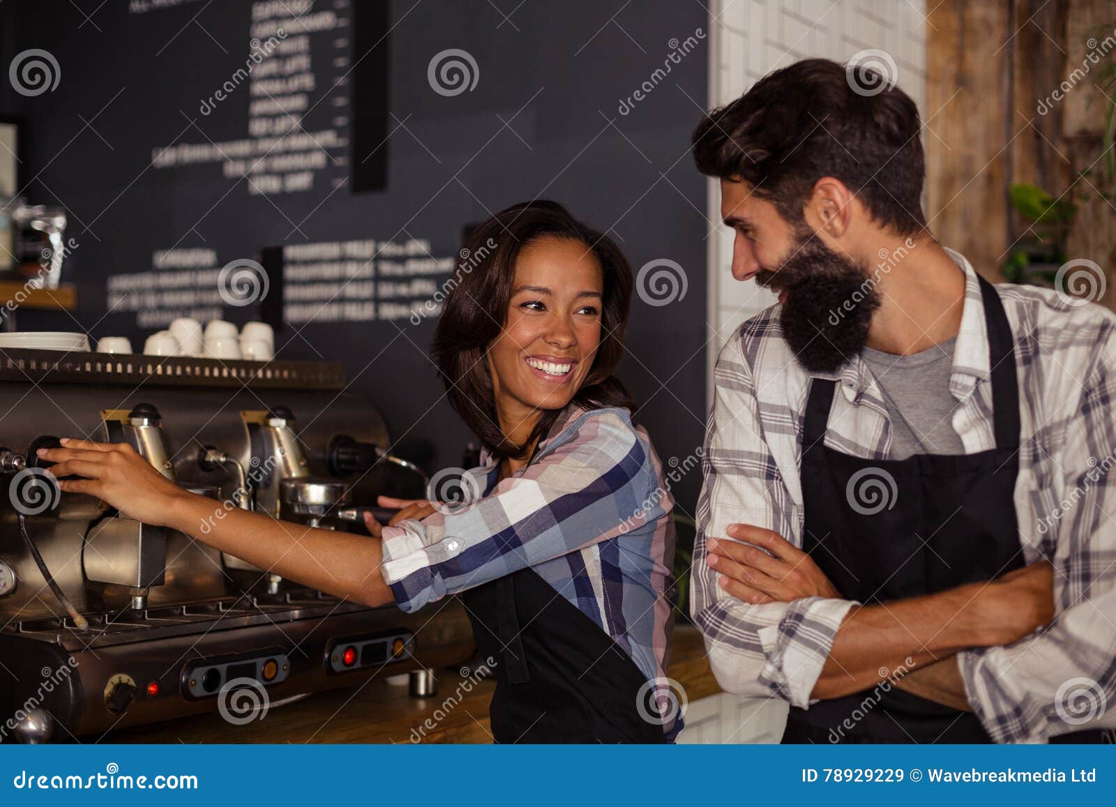 Waiter and Waitress Interacting while Working in Kitchen Stock Image ...