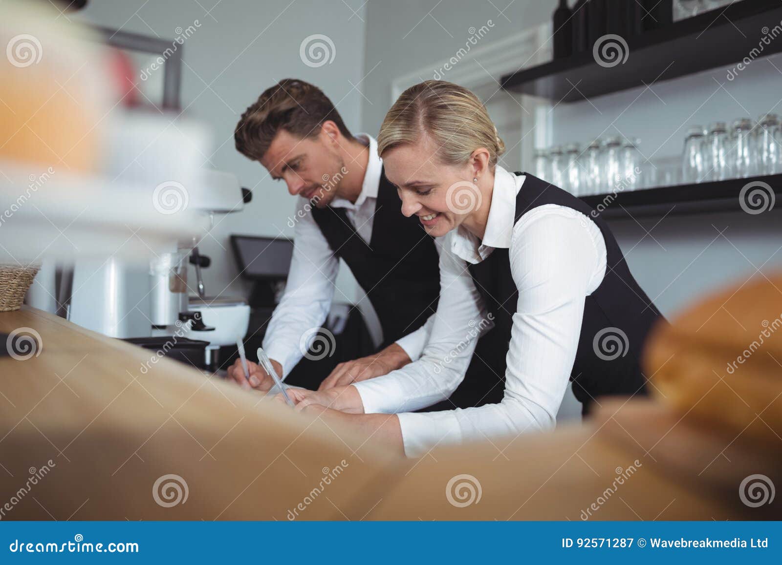 Waiter and Waitress Working at Counter Stock Image - Image of adult ...