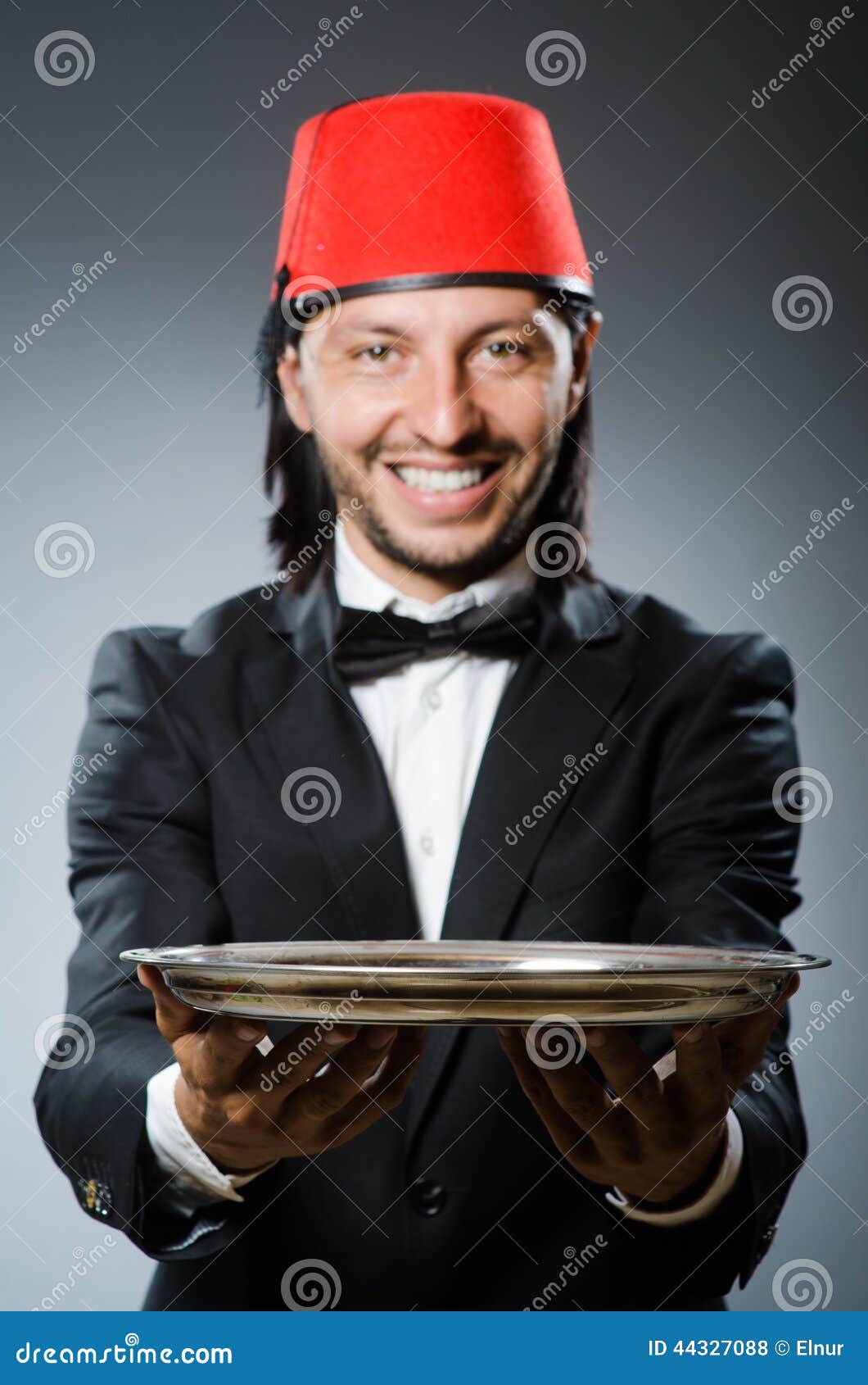 Waiter wearing traditional stock photo. Image of headgear - 44327088