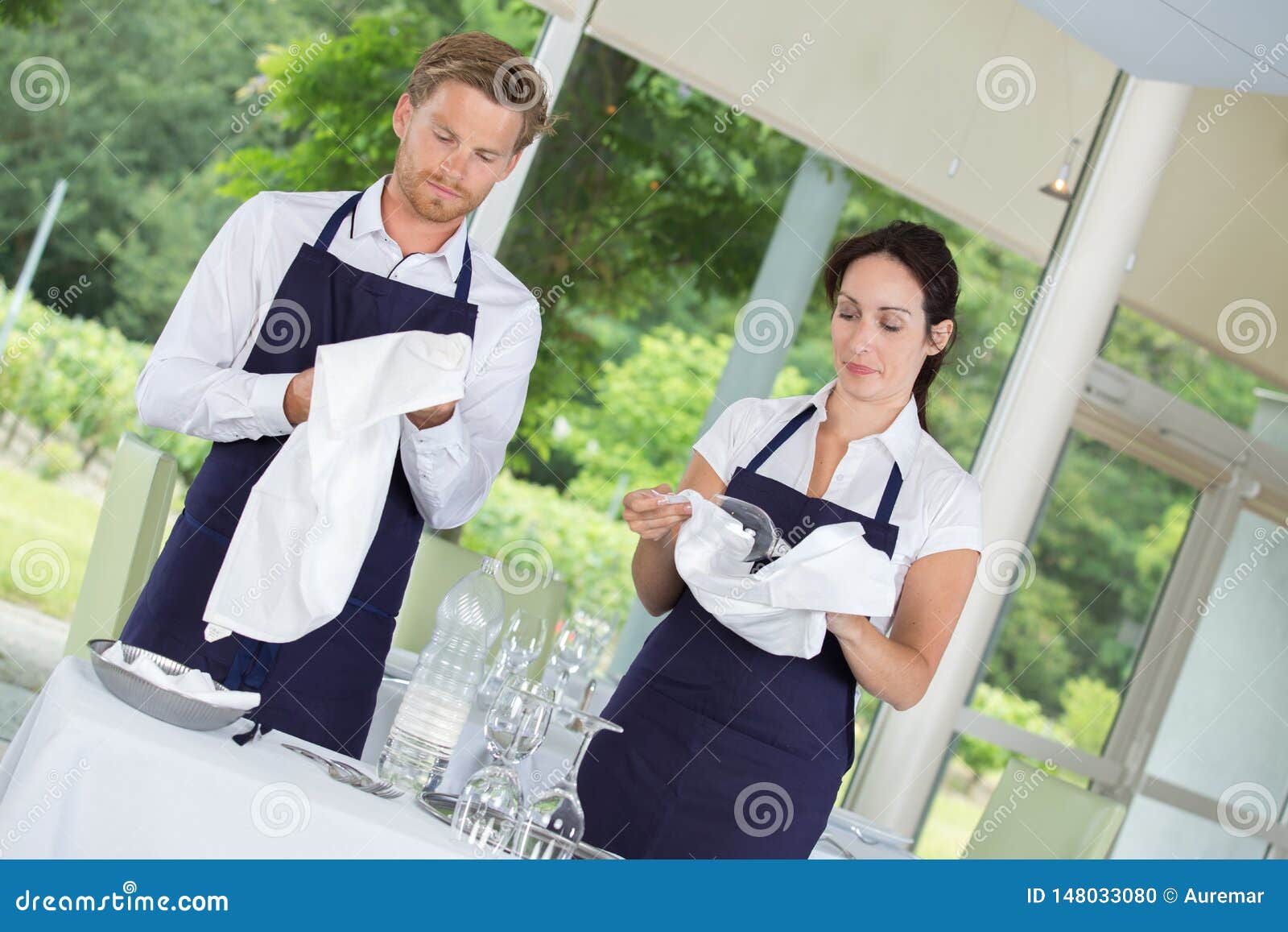 2 Waiters Setting Up Restaurant Tables Stock Photo - Image of people ...