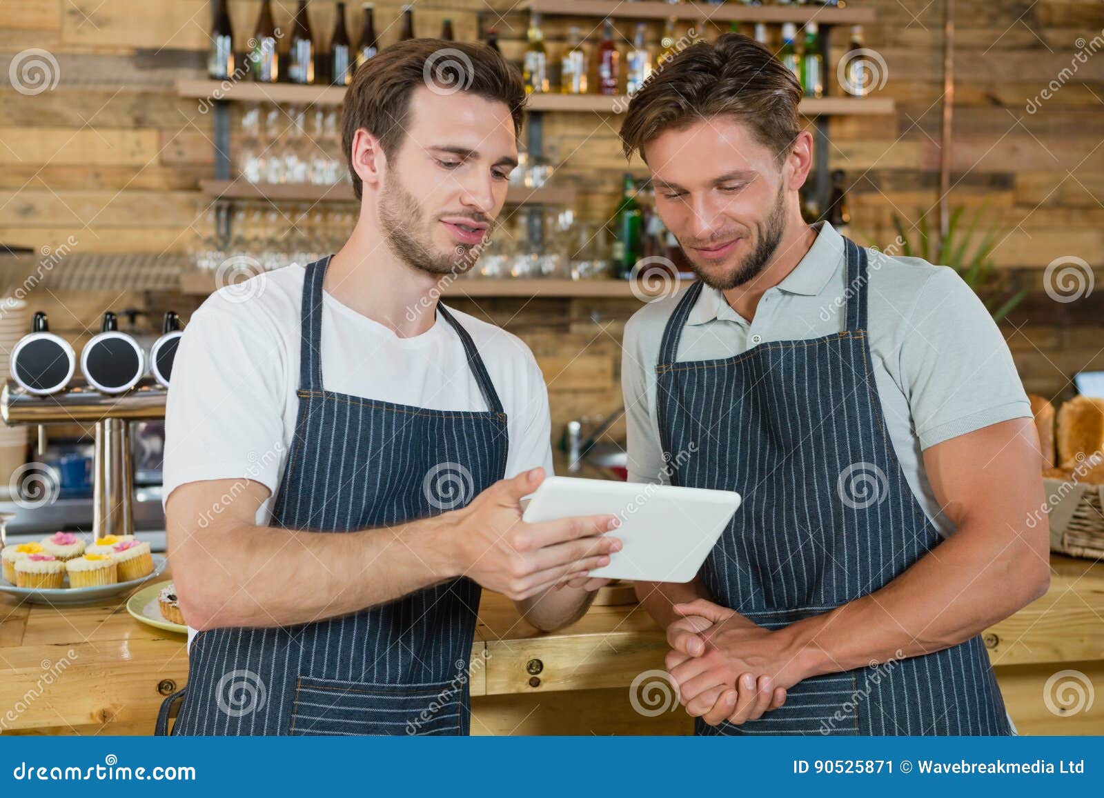 Waiters Using Digital Tablet at Counter Stock Image - Image of browsing ...