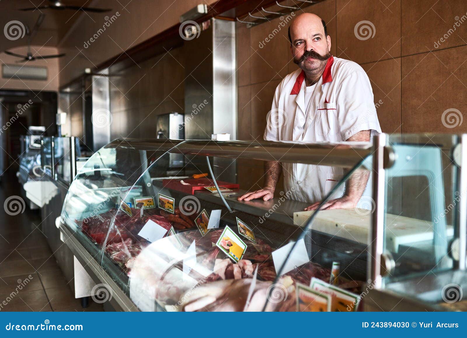 Waiting for Customers. Shot of a Butcher at His Store. Stock Photo ...