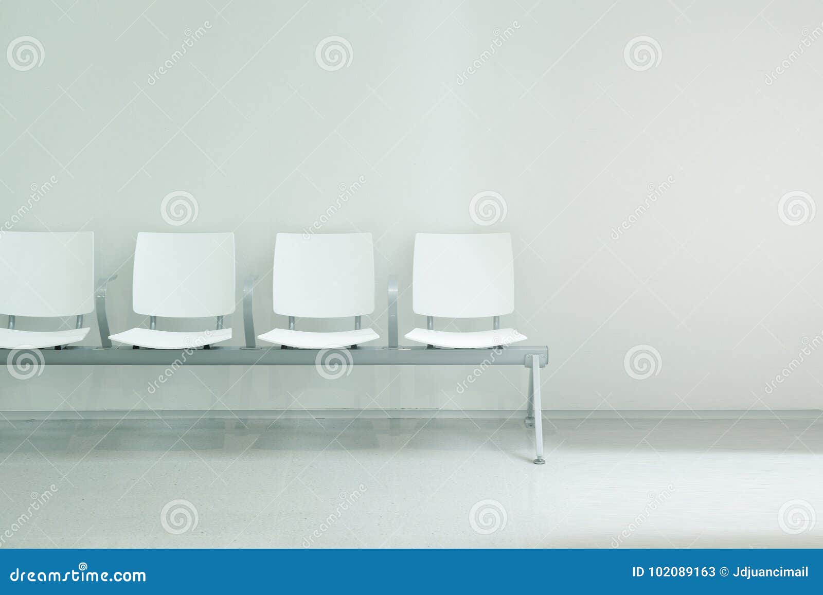 Waiting Hall Chairs Forming a Row Against a White Wall Background Stock ...
