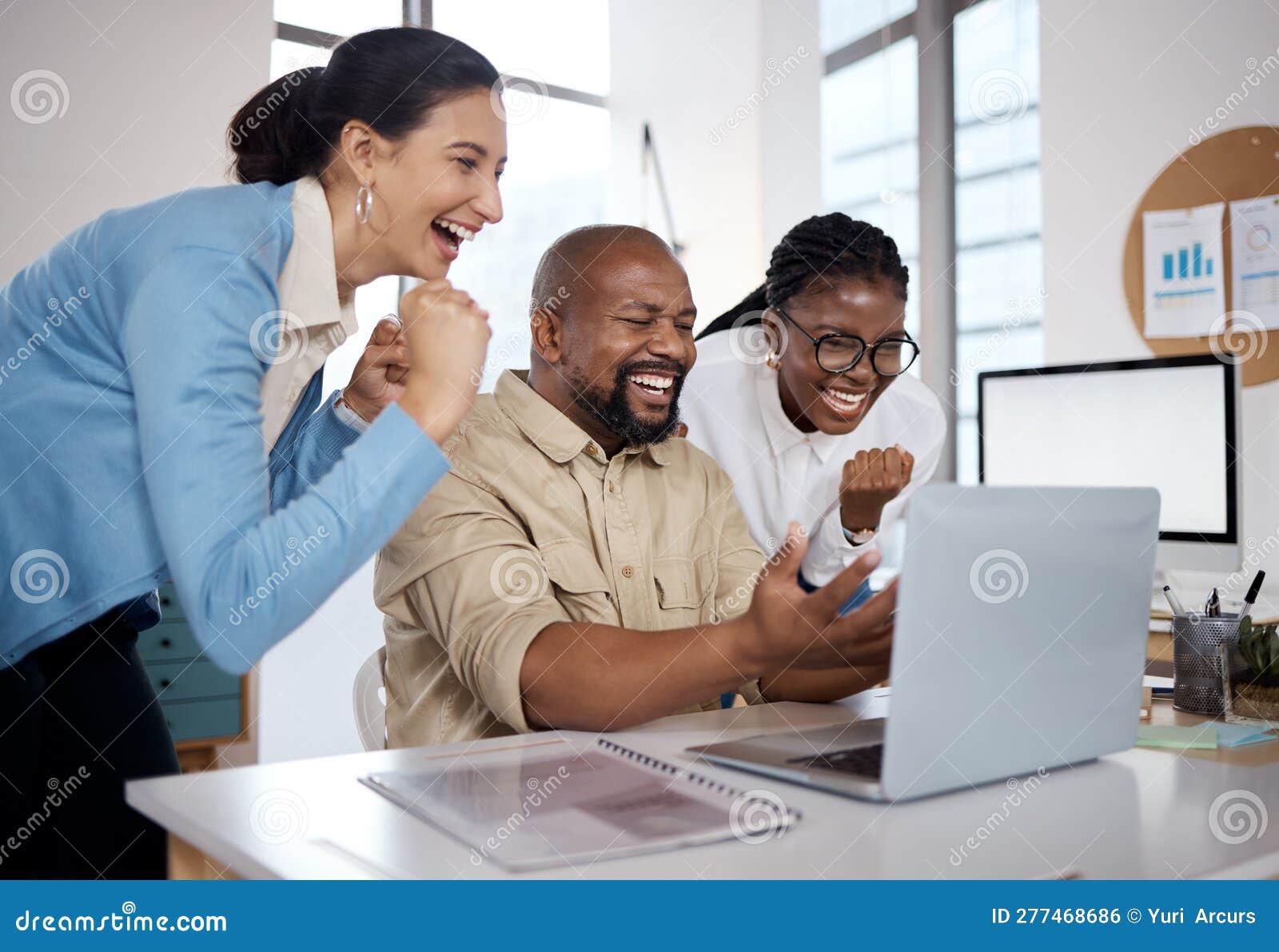 Waiting on Important Feedback. a Group of Businesspeople Using a Laptop ...