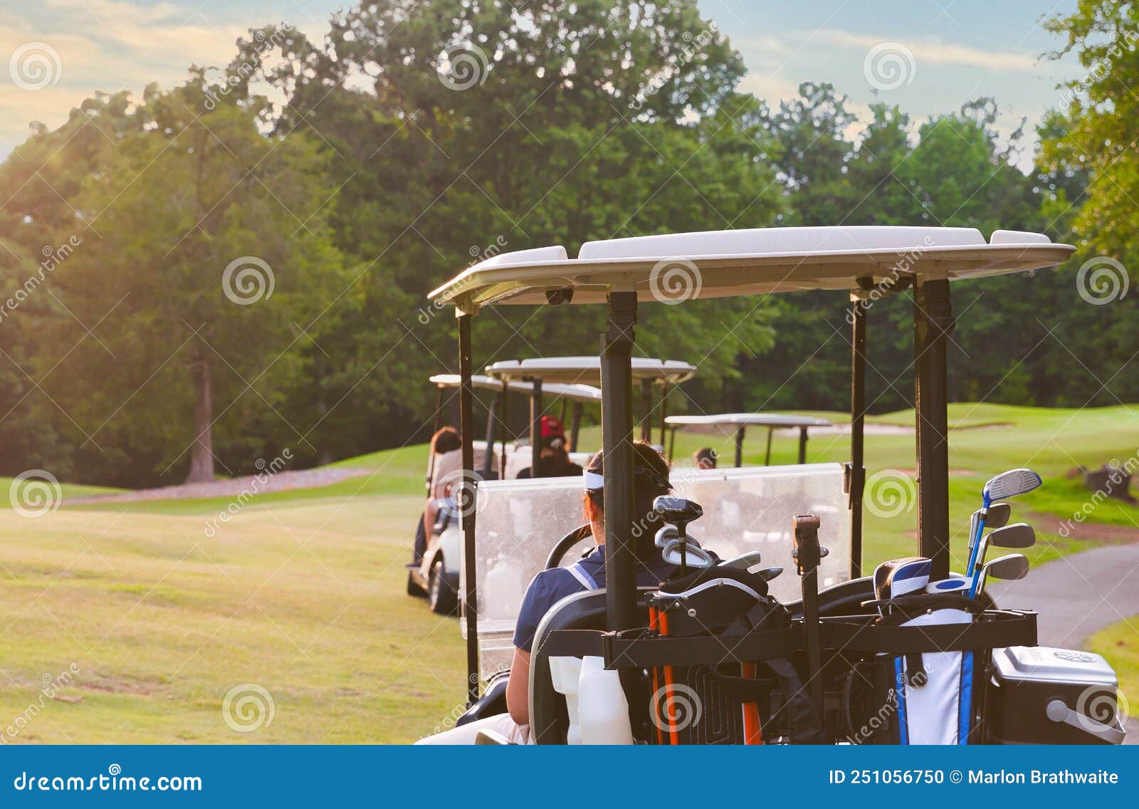 Waiting for Tee Time at the Golf Course. Stock Photo - Image of sunset ...