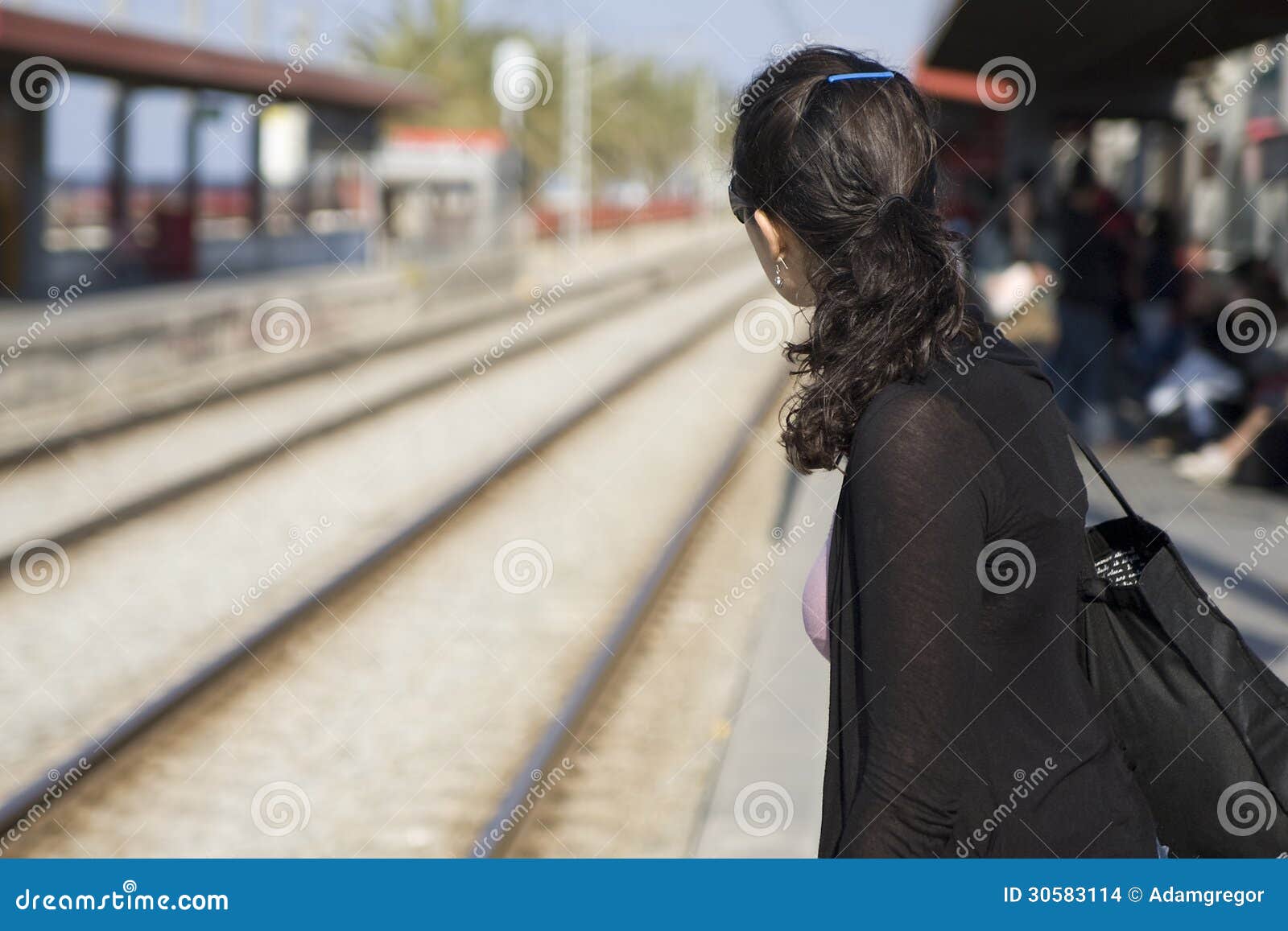 Waiting for train stock photo. Image of brunette, station - 30583114
