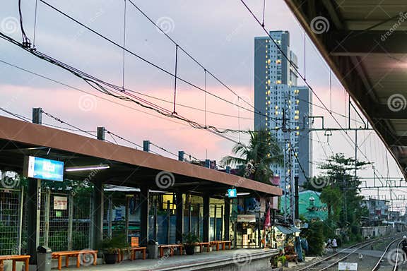 Waiting for the Train at Sunset in a Suburban Station in Java ...
