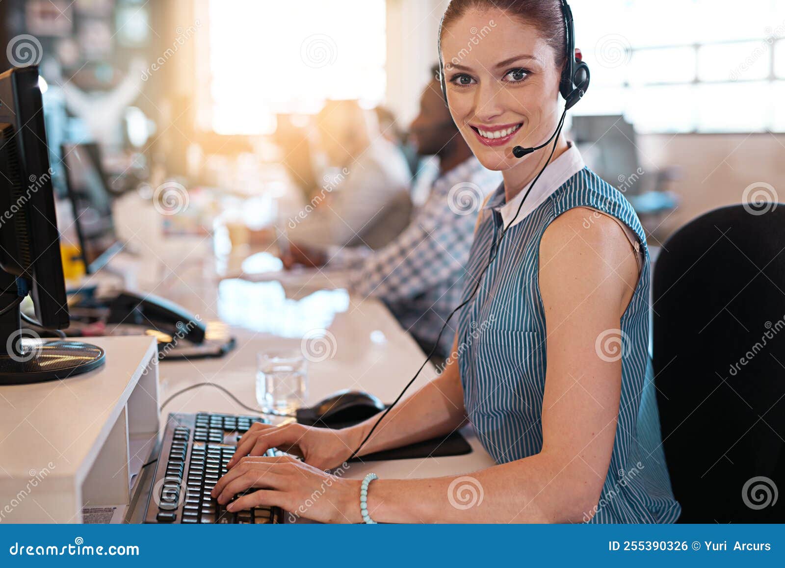 Waiting for Your Call. Portrait of a Happy Call Center Agent Working at ...