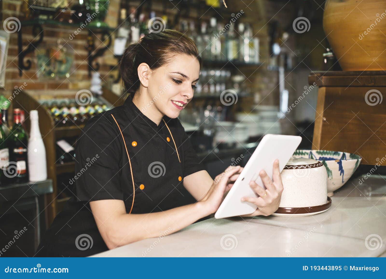 Waitress in Bar with Tablet Looking Orders Stock Image - Image of order ...