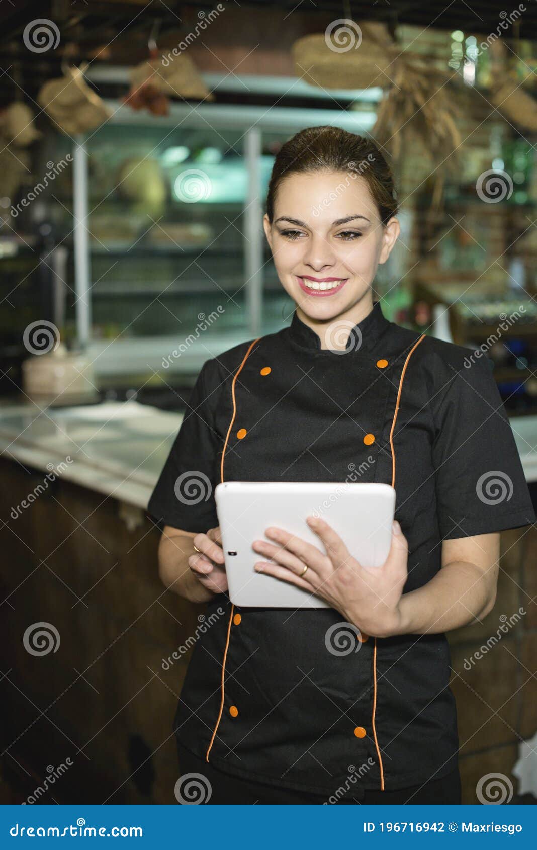 Waitress in Bar with Tablet Looking Orders Stock Photo - Image of ...
