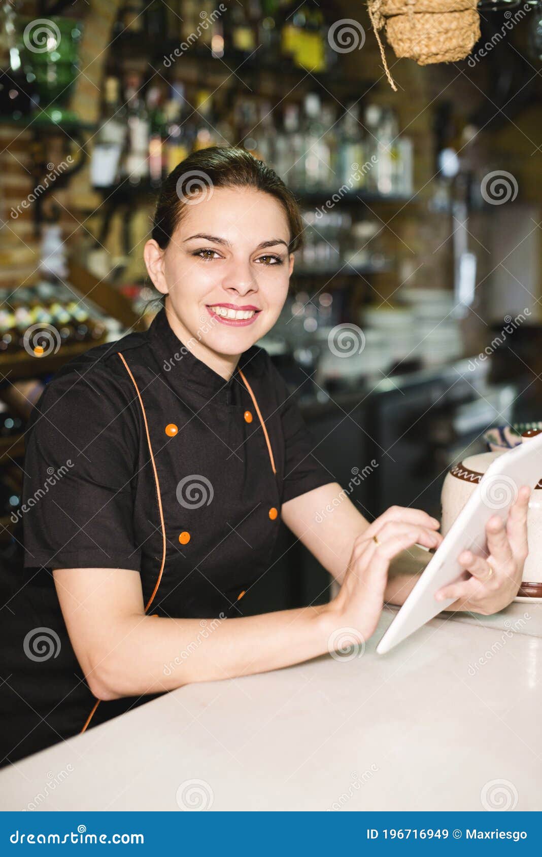Waitress in Bar with Tablet Looking Orders Stock Image - Image of happy ...