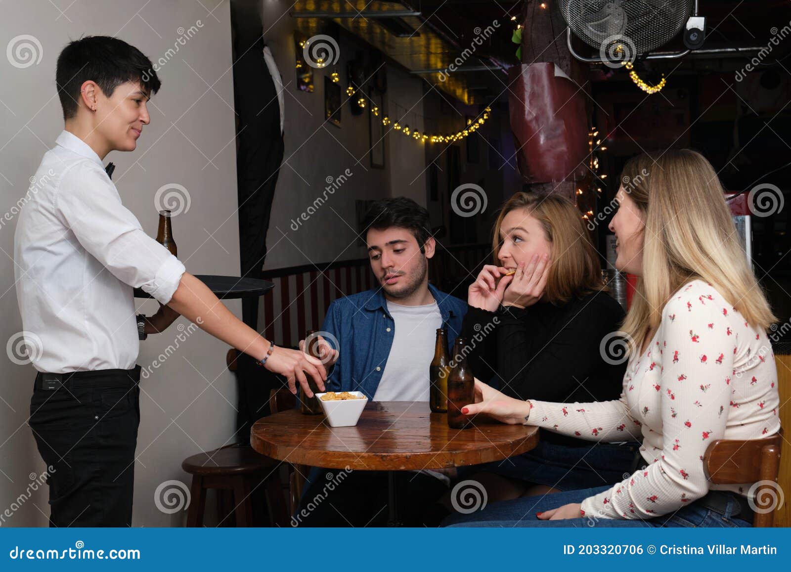 Waitress Bringing Drinks To Her Customers Stock Photo - Image of ...