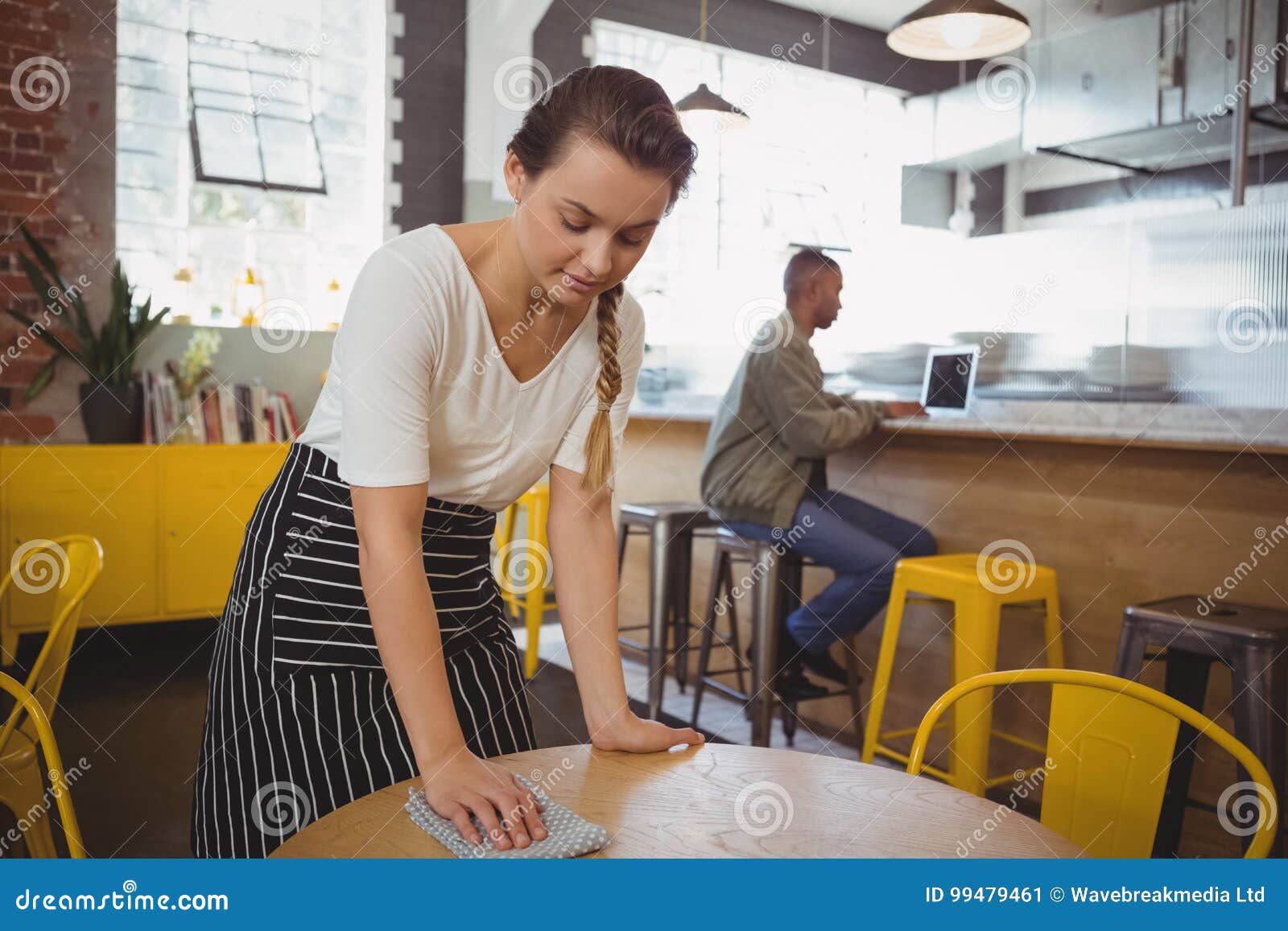 Waitress cleaning table stock image. Image of male, beautiful - 99479461