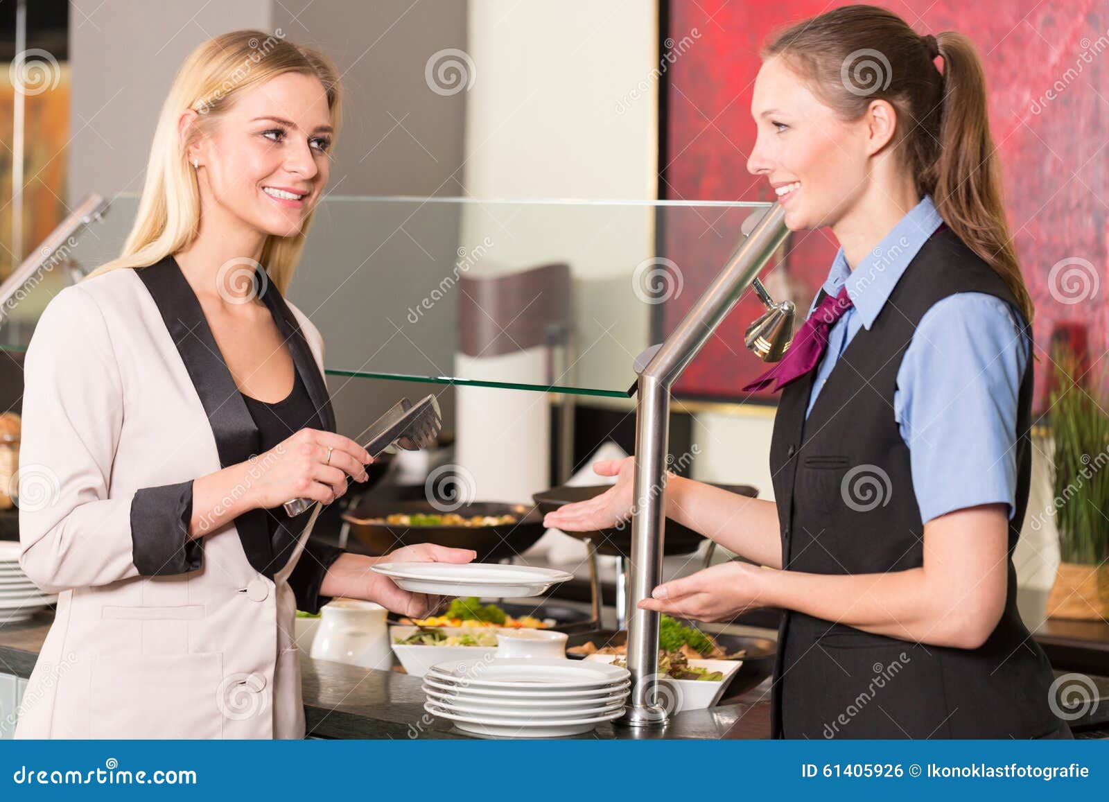 Waitress Consulting Guest or Customer in Restaurant about the Buffet ...