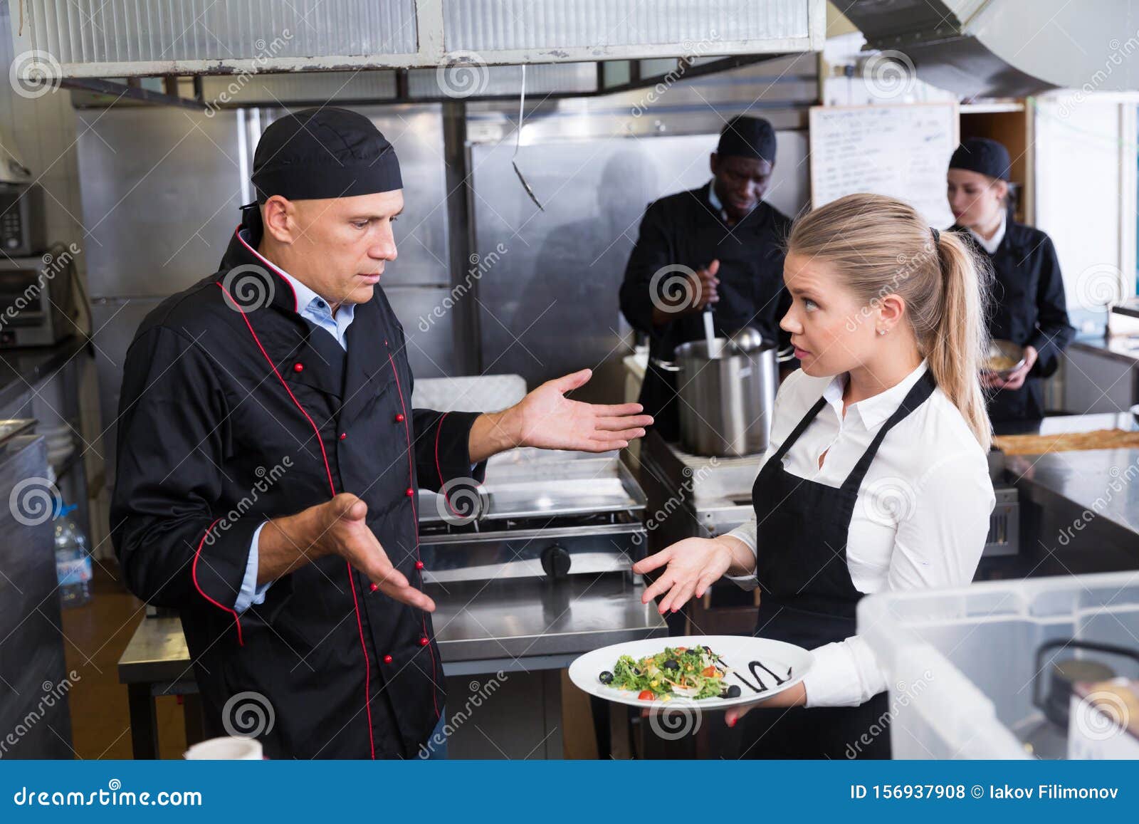 Waitress with Dish Talking with Puzzled Chef Stock Photo - Image of ...