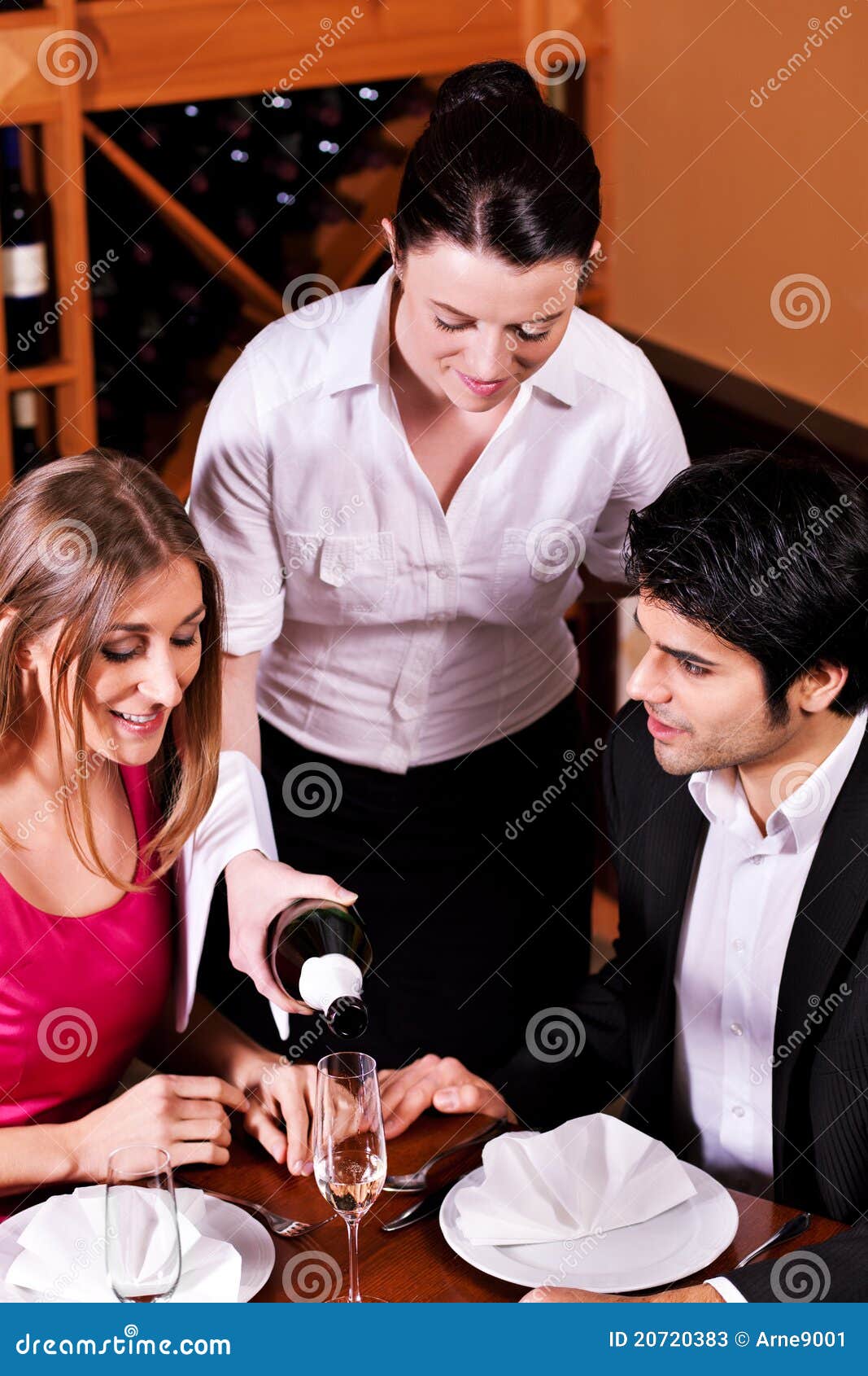 Waitress Filling Glasses with Champagne Stock Image - Image of husband ...
