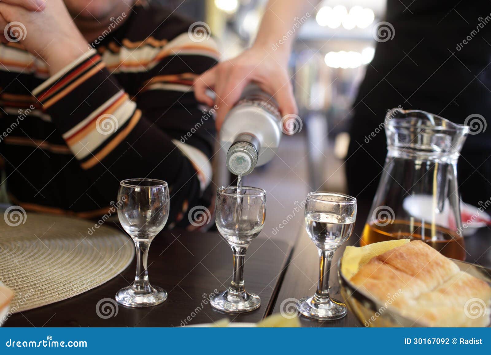 Waitress Filling Glasses of Vodka Stock Photo - Image of beverage ...