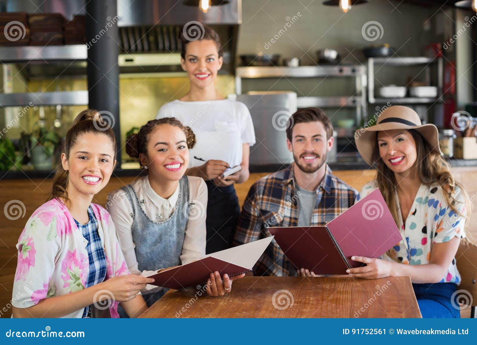 Waitress with Happy Customers in Restaurant Stock Image - Image of ...