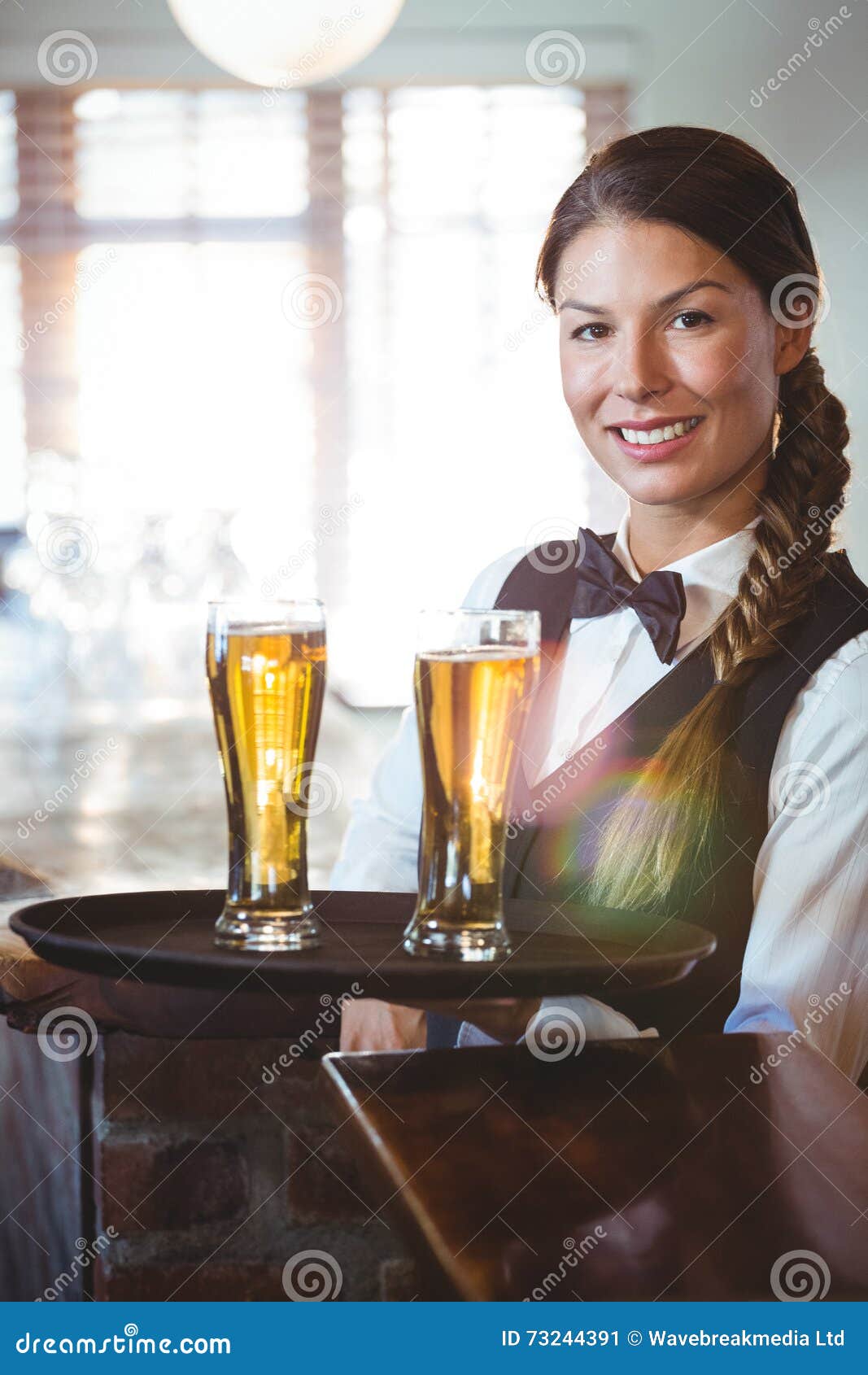 Waitress holding beers stock image. Image of barista - 73244391