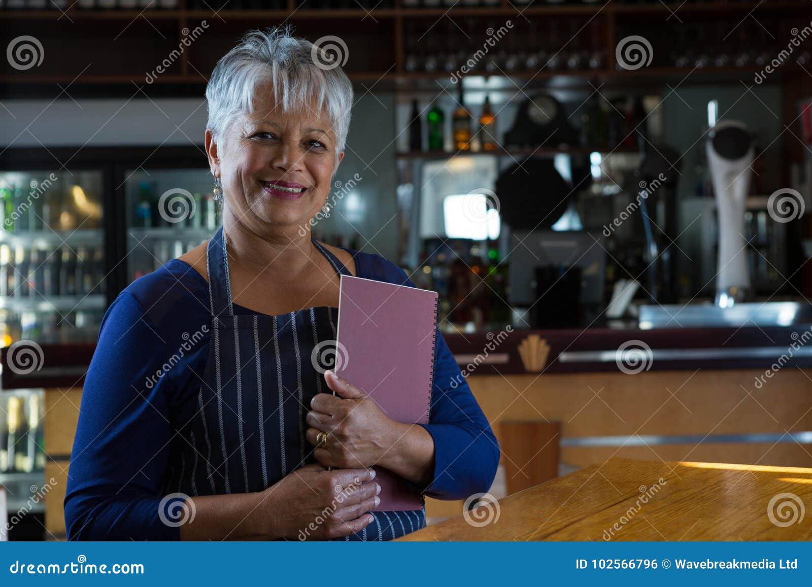 Waitress holding menu card stock photo. Image of holding - 102566796