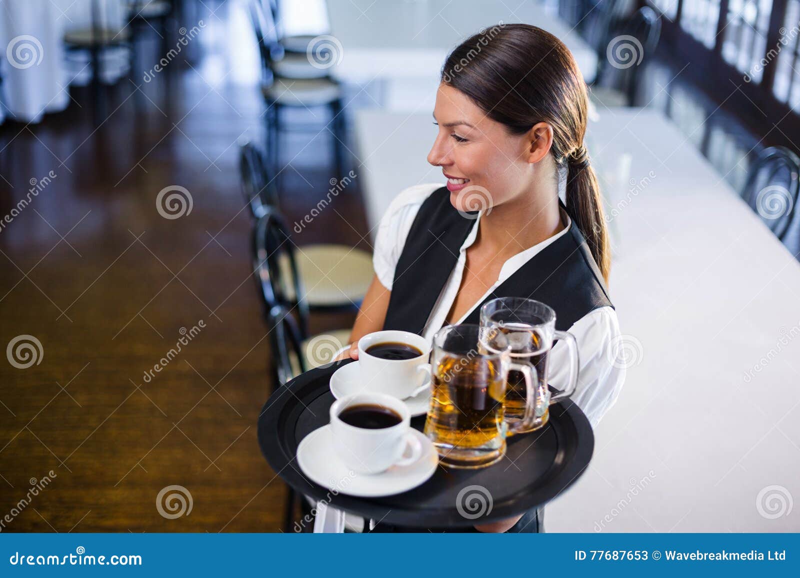 Waitress Holding Serving Tray with Coffee Cup and Pint of Beer Stock ...