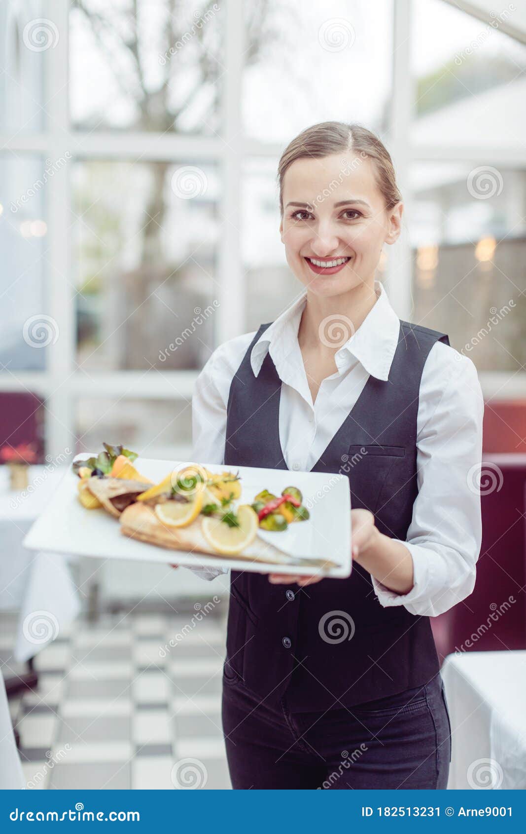Waitress in a Nice Restaurant Presenting a Tasty Dish Stock Image ...