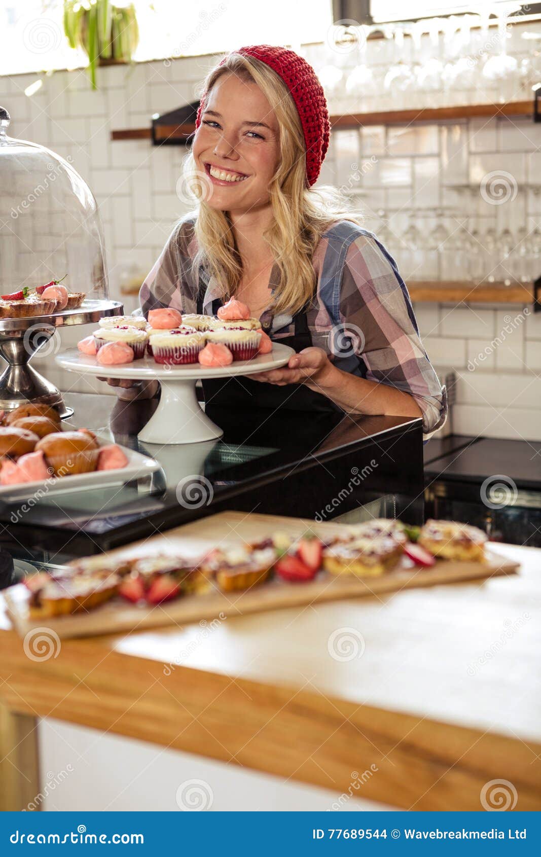 Waitress posing with cakes stock photo. Image of industry - 77689544
